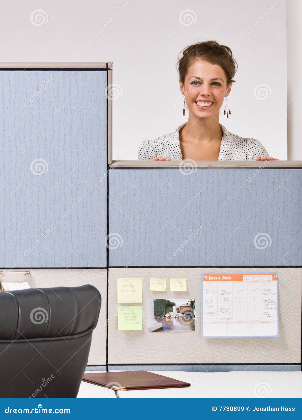 Businesswoman Peering Over Cubicle Wall Royalty-Free Stock Photo ...
