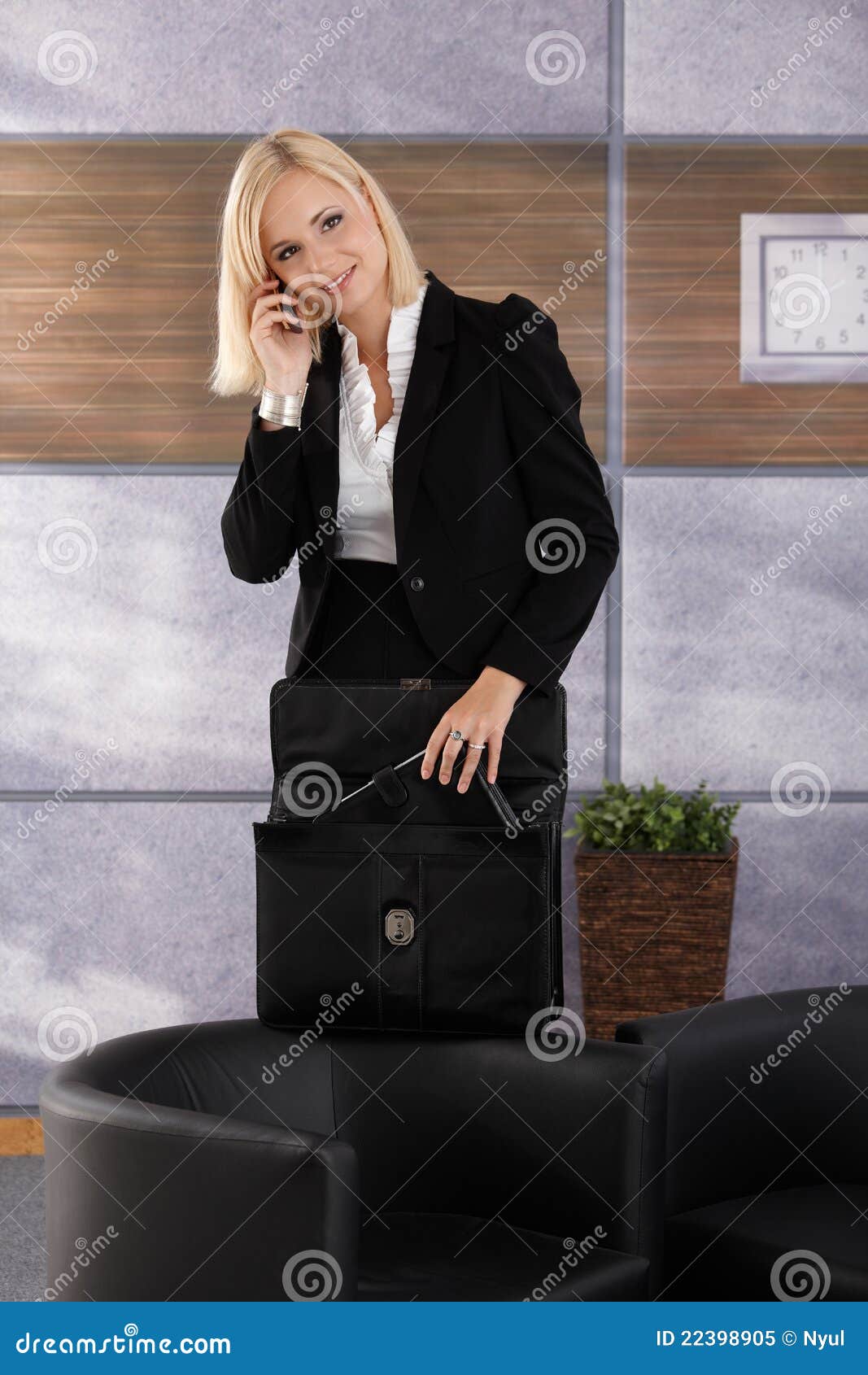 Businesswoman on Phone Opening Briefcase Stock Image - Image of ...