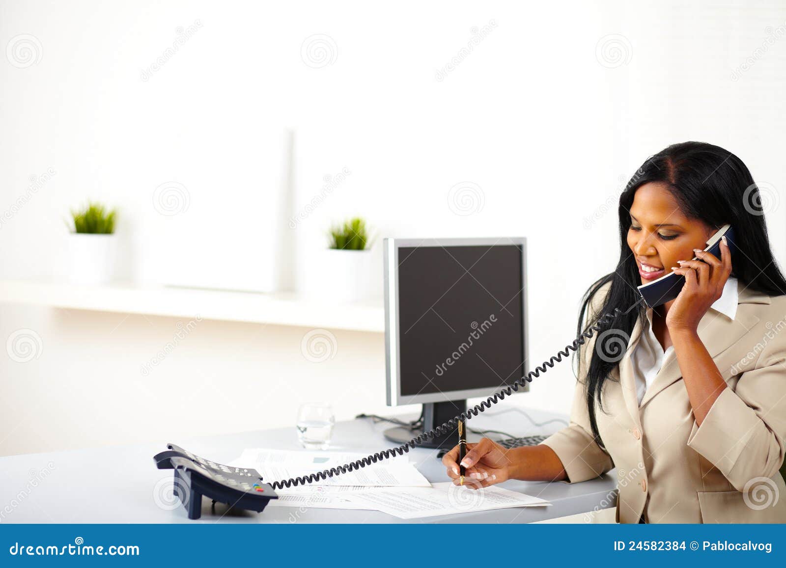 Businesswoman on Phone while Working Stock Photo - Image of ...