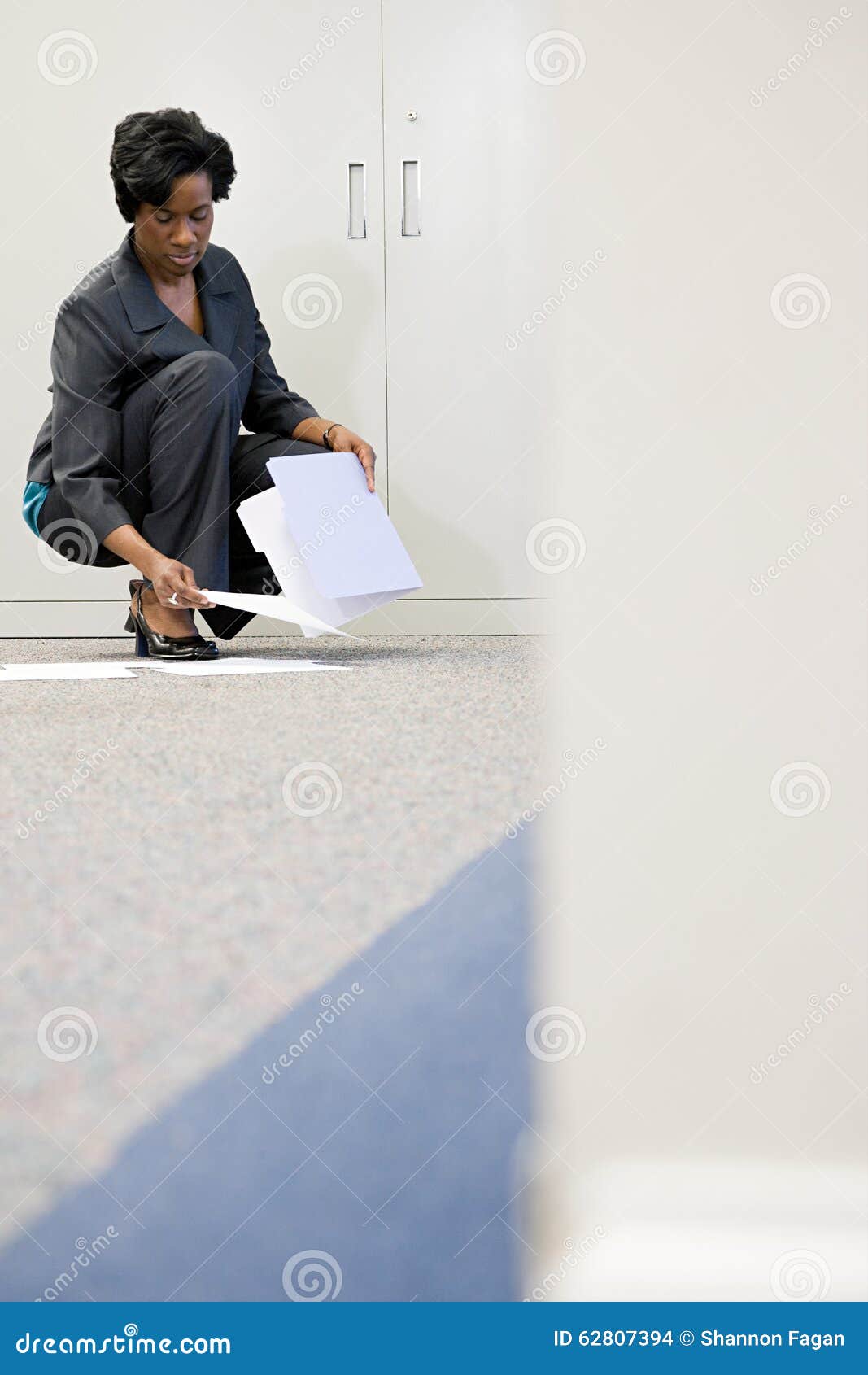 Businesswoman Picking Up Paper Stock Photo - Image of finding, dropping ...