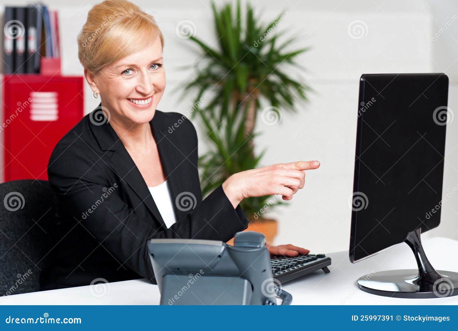 Businesswoman Pointing at Computer Screen Stock Image - Image of adult ...