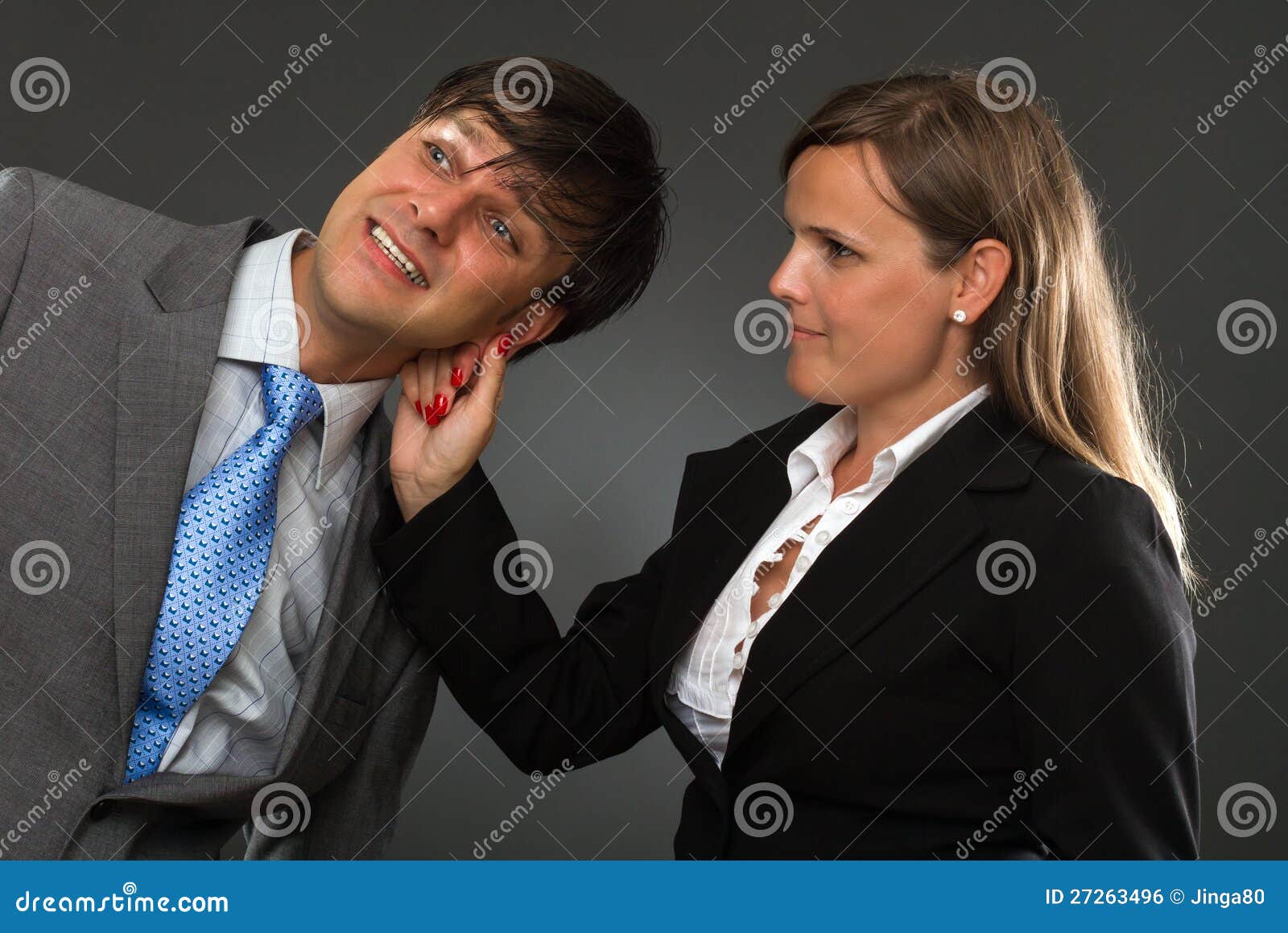 Businesswoman Pulling a Businessman Ear Stock Photo - Image of ...