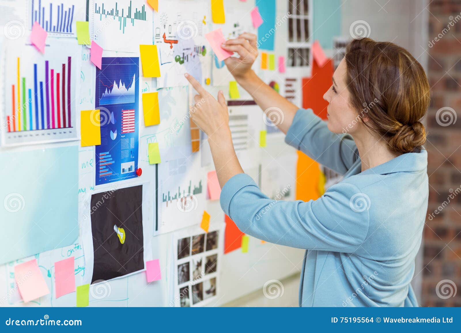 Businesswoman Putting Sticky Notes on Whiteboard Stock Photo - Image of ...