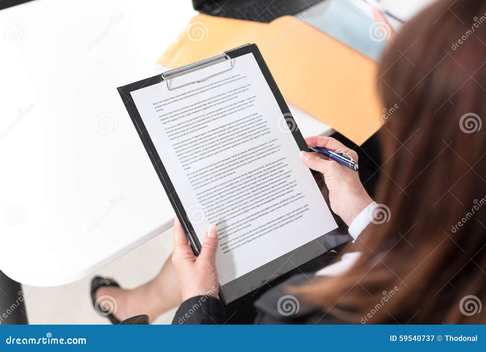 Businesswoman Reading a Document Stock Image - Image of adult, business ...