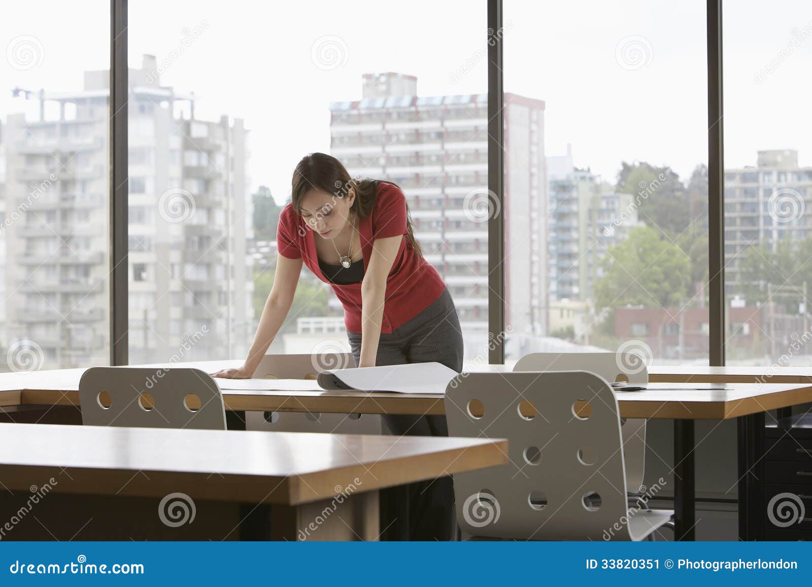 Businesswoman Reading at Office Desk Stock Image - Image of female ...