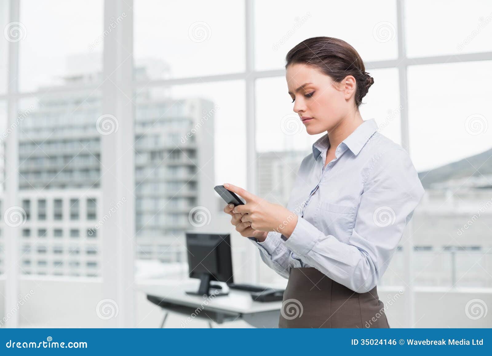 Businesswoman Reading Text Message in Office Stock Photo - Image of ...