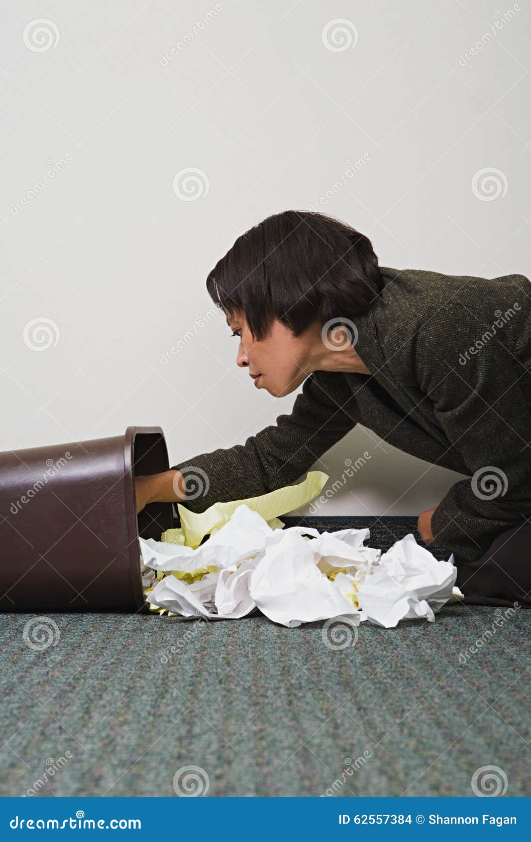 Businesswoman Searching through Rubbish Bin Stock Photo - Image of ...