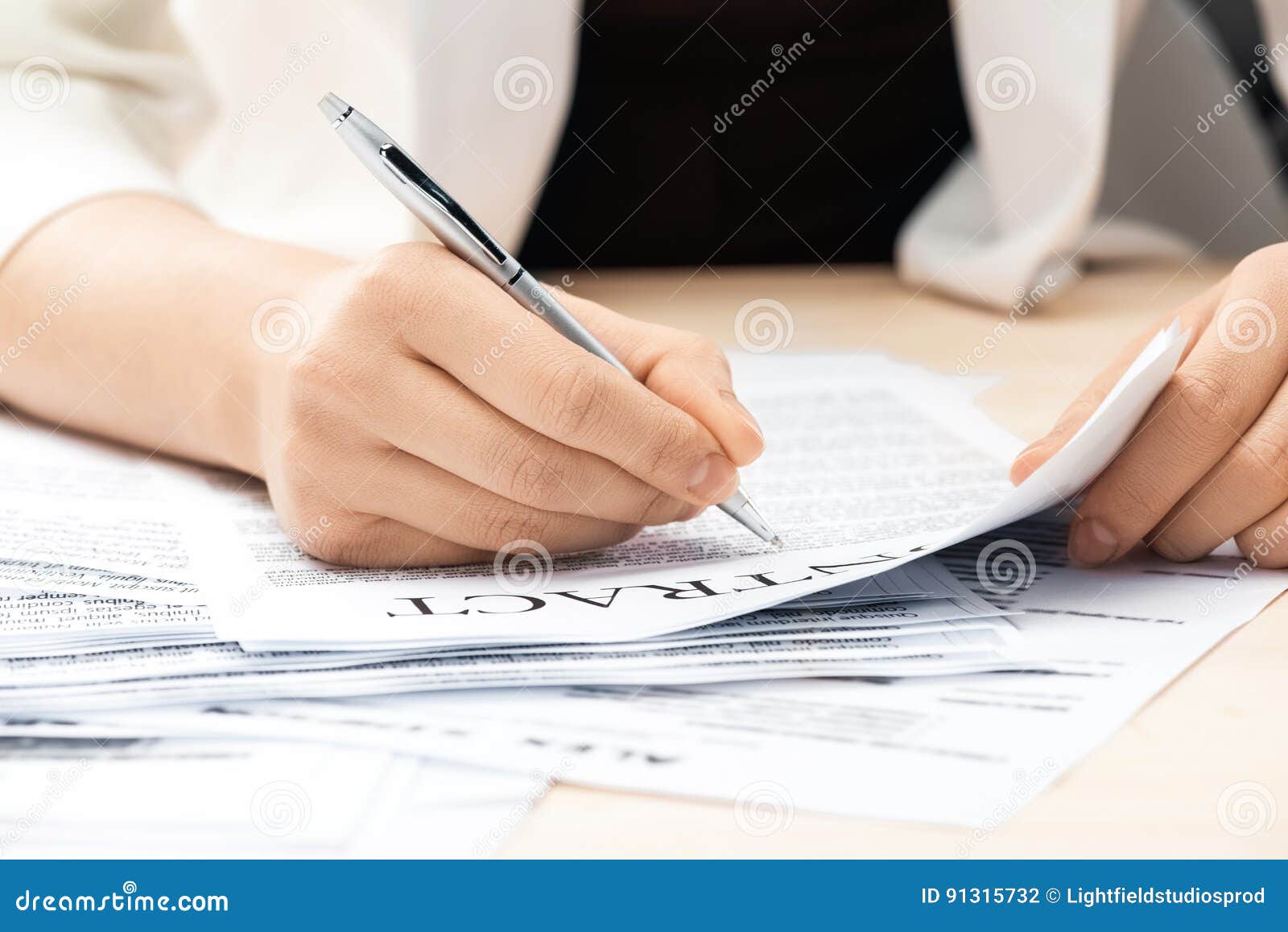 Businesswoman Signing Contract Documents Sitting at Table Stock Photo ...