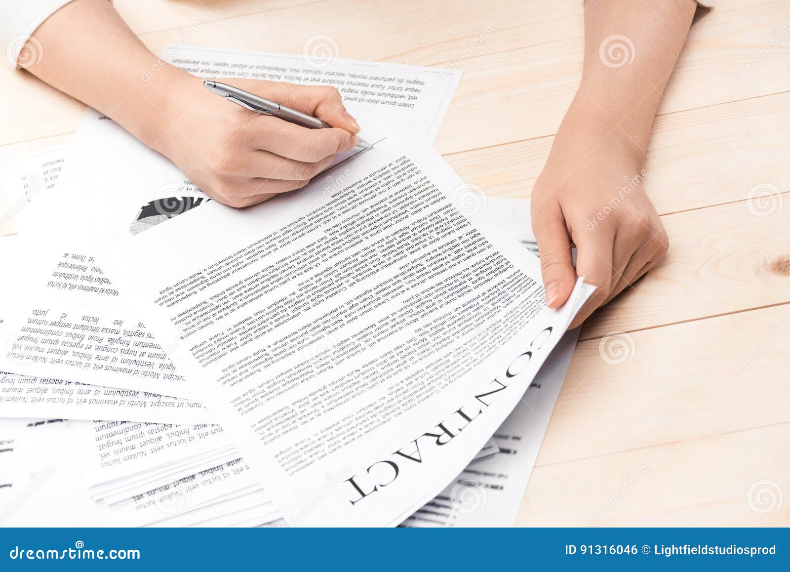 Businesswoman Signing Contract Documents Sitting at Table Stock Photo ...
