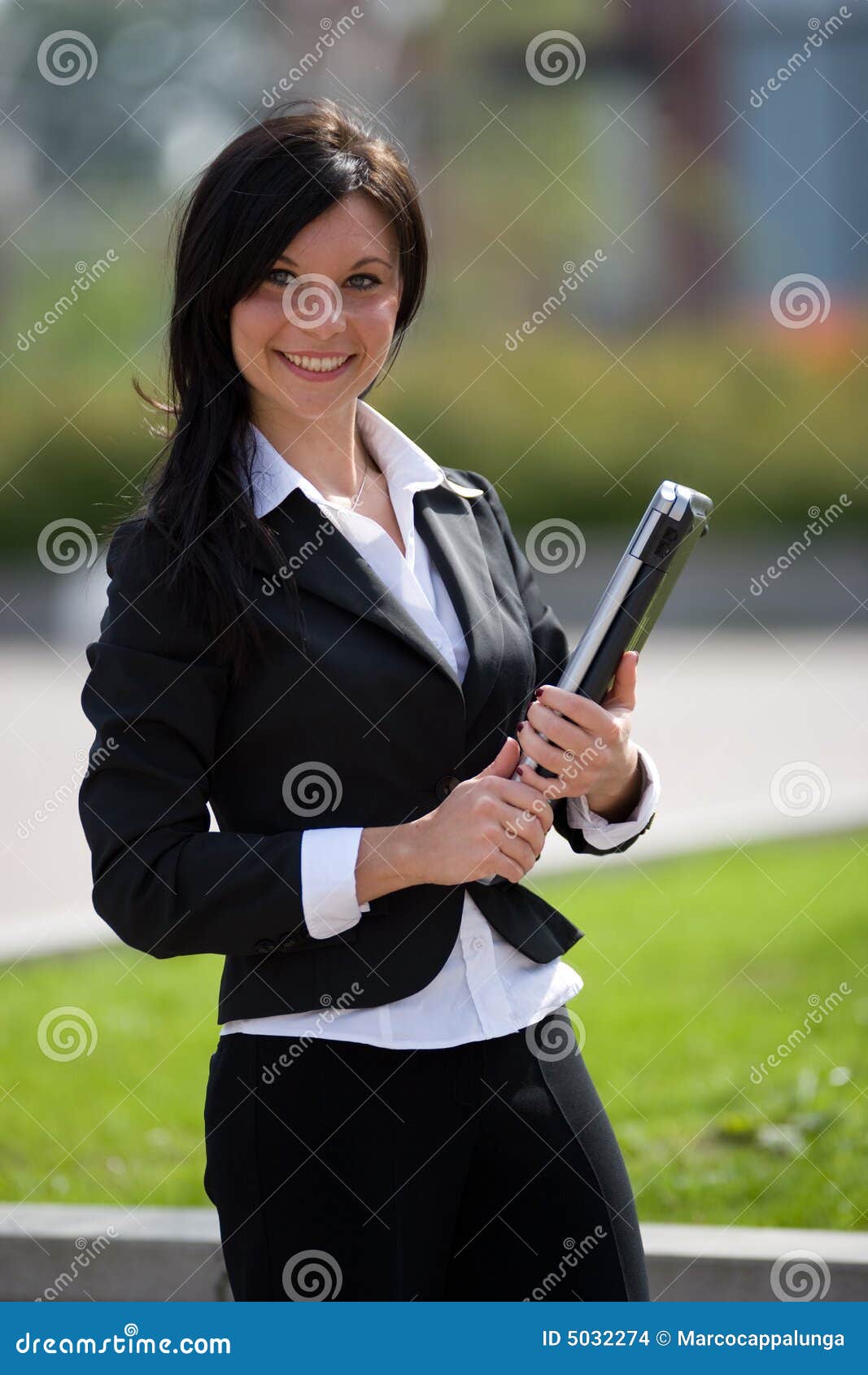 Businesswoman Standing with a Laptop Stock Photo - Image of positive ...