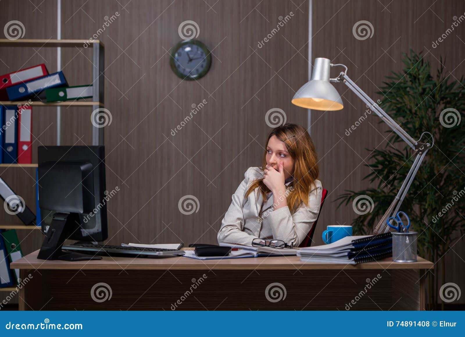 The Businesswoman Staying in the Office for Long Hours Stock Photo ...