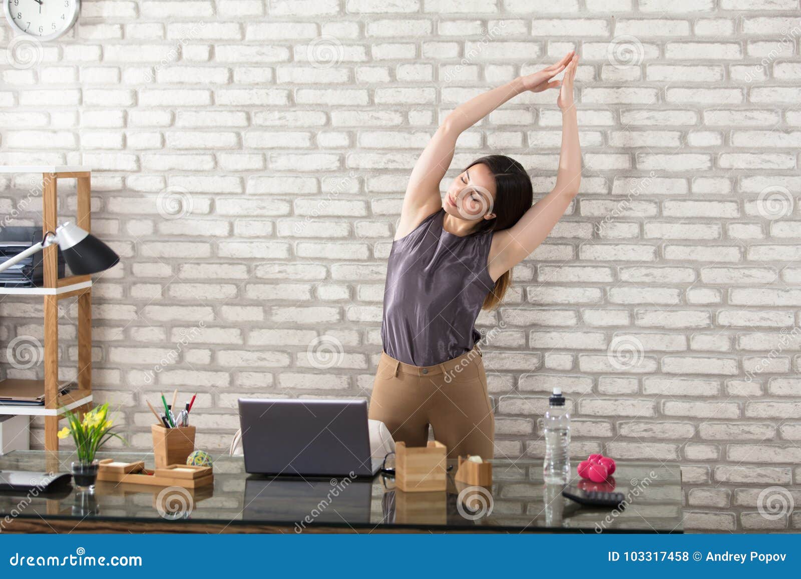 Businesswoman Stretching stock photo. Image of beautiful - 103317458