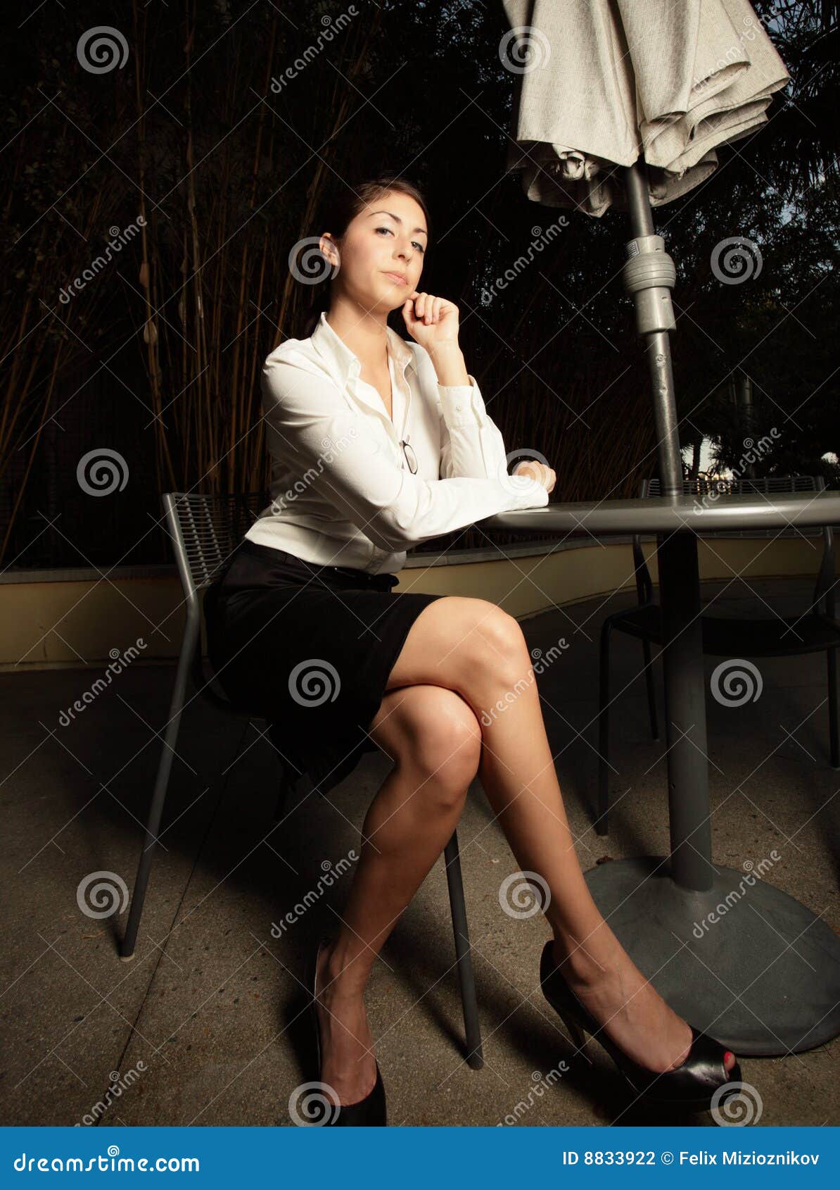 Businesswoman at a table stock photo. Image of sitting - 8833922