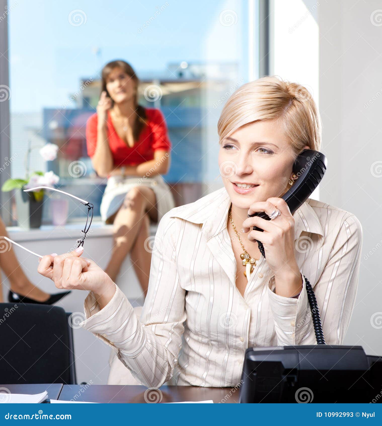 Businesswoman Talking on Landline Phone Stock Image - Image of desk ...