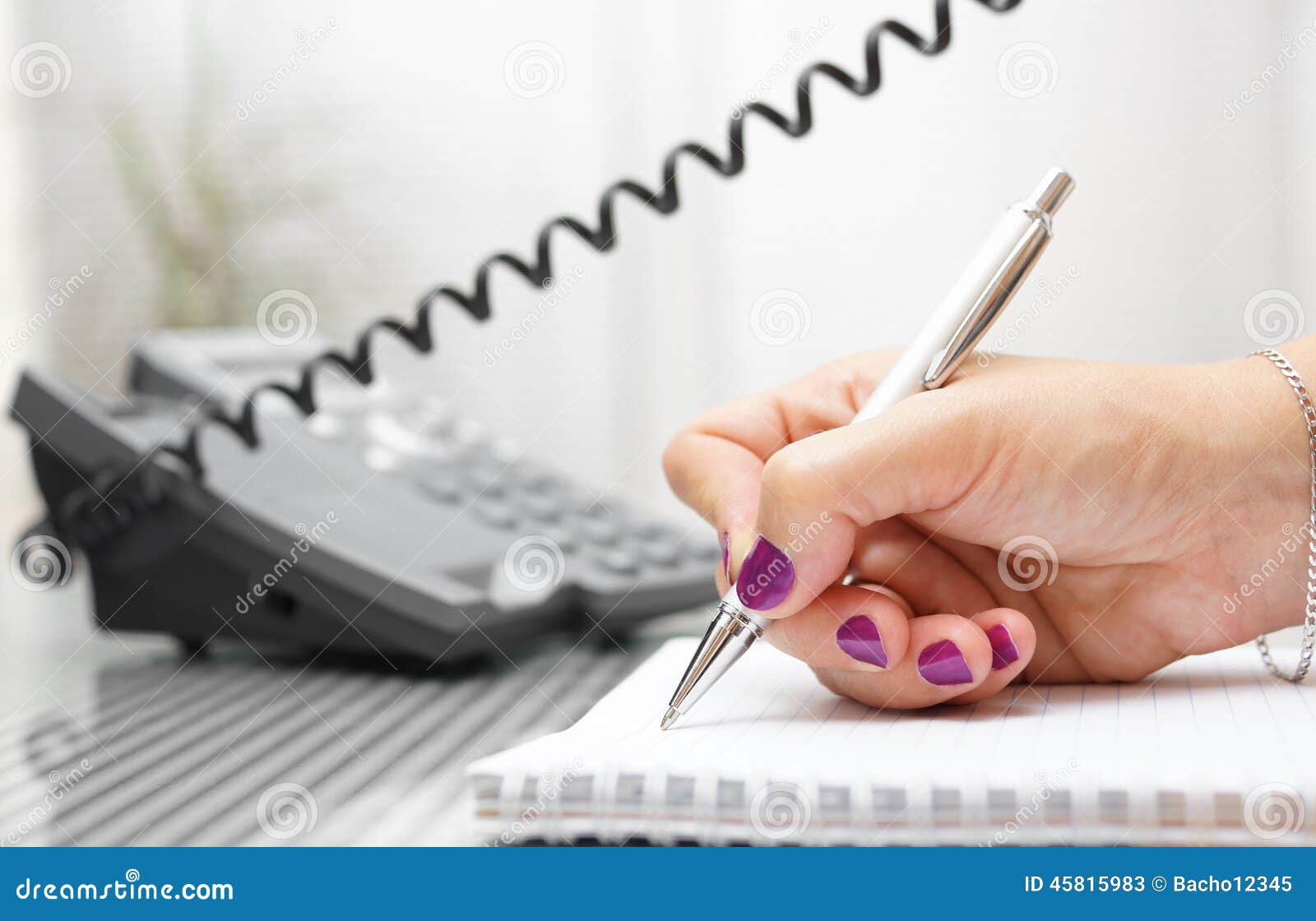 Businesswoman is Talking on the Phone and Taking Notes Stock Image ... Businesswoman is Talking on the Phone and Taking Notes Stock Image ...
