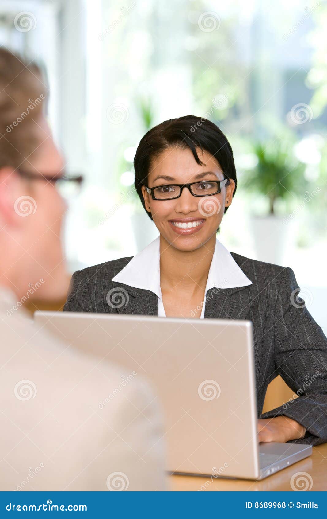 Businesswoman Talking To Client Stock Photo - Image of laptop ...