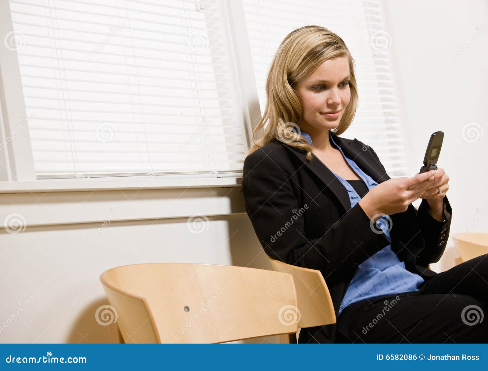 Businesswoman Text Messaging on Cell Phone Stock Photo - Image of cell ...