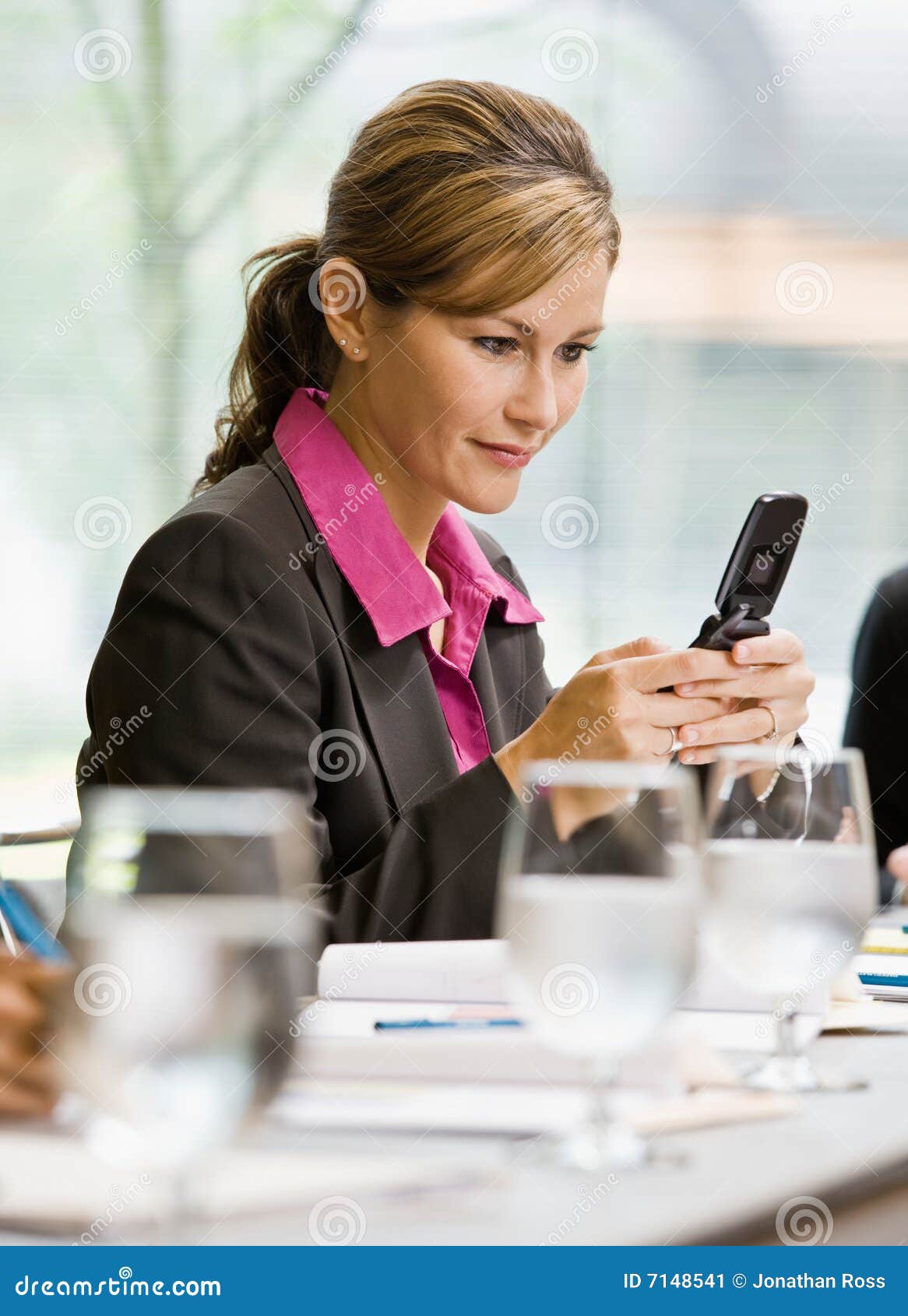 Businesswoman Text Messaging on Cell Phone Stock Image - Image of ...