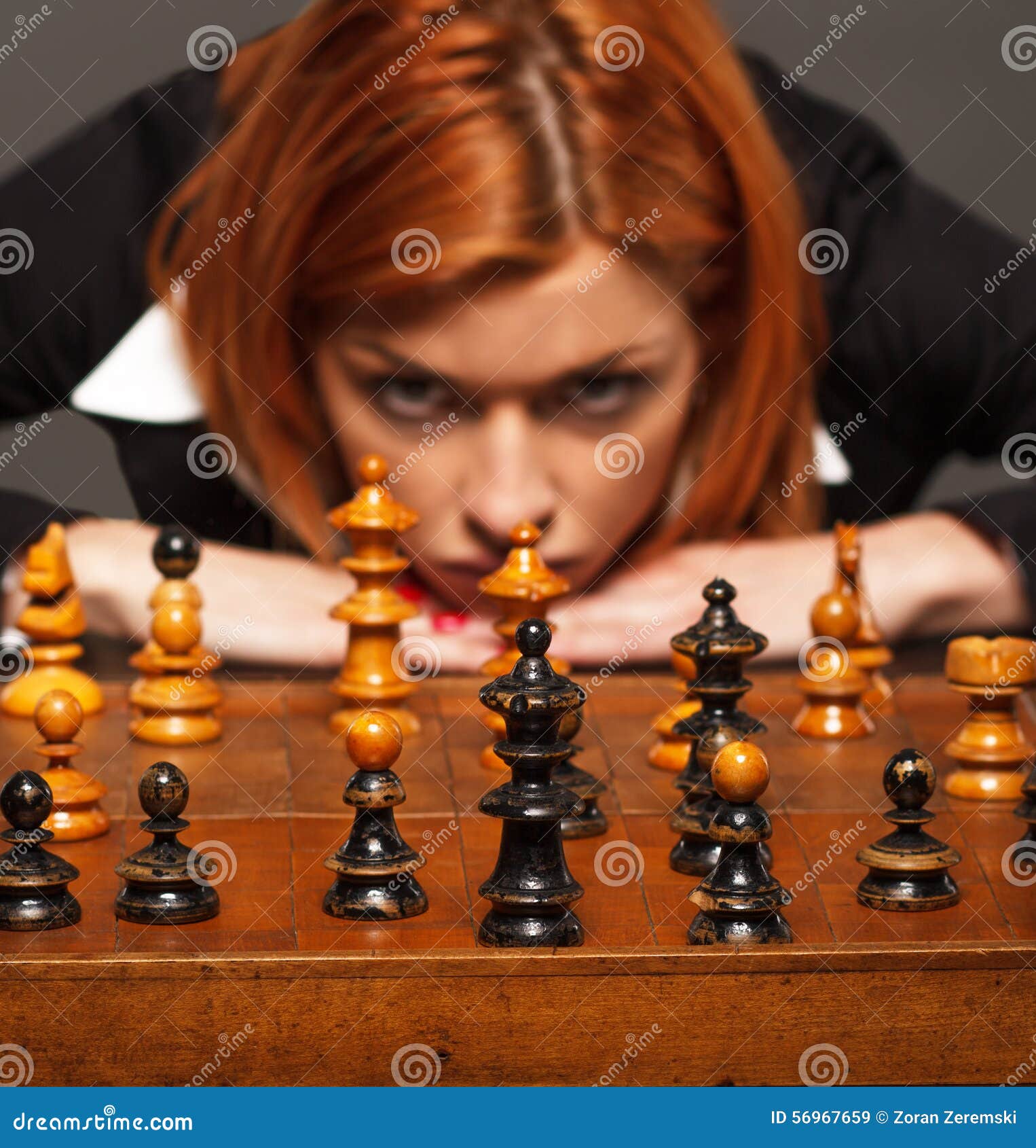 Businesswoman Thinking about Her Next Move in a Game of Chess Stock ...