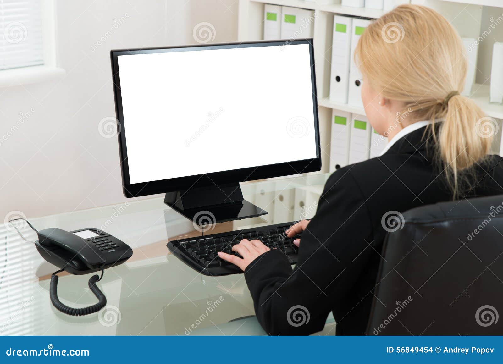 Businesswoman Using Computer at Desk Stock Photo - Image of corporate ...