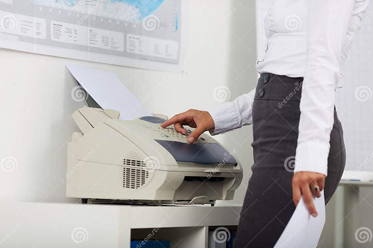 Businesswoman Using Copy Machine Stock Photo - Image of document ...