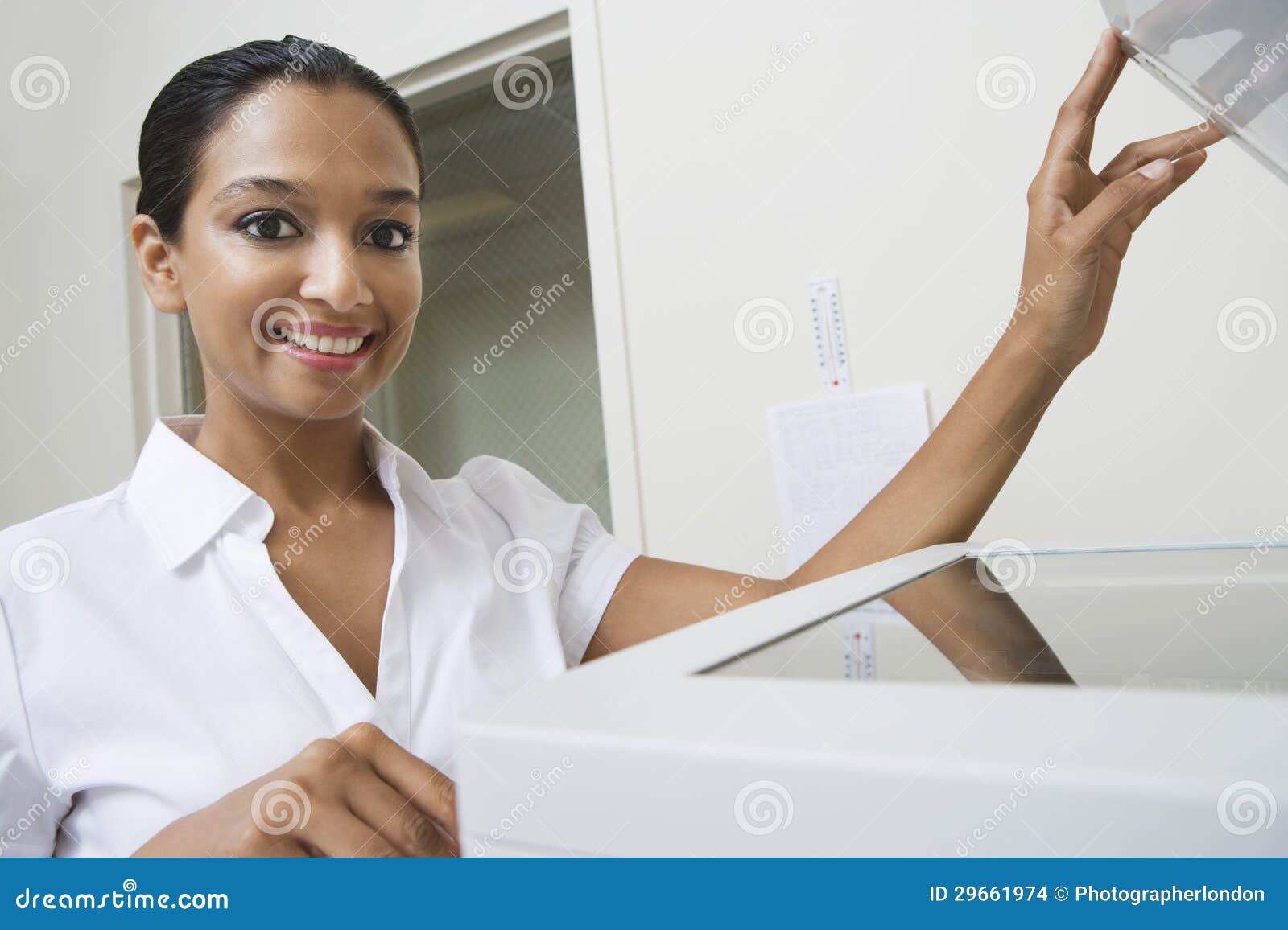 Businesswoman Using Fax Machine in Office Stock Photo - Image of ...