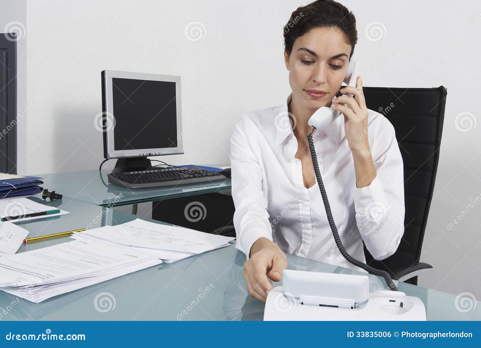 Businesswoman Using Landline Phone At Office Desk Royalty-Free Stock ... Businesswoman Using Landline Phone At Office Desk Royalty-Free Stock ...