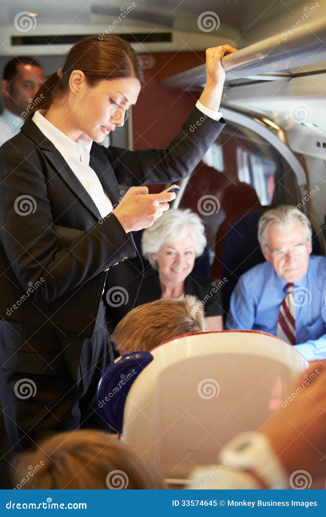 Businesswoman Using Mobile Phone on Busy Commuter Train Stock Image ...