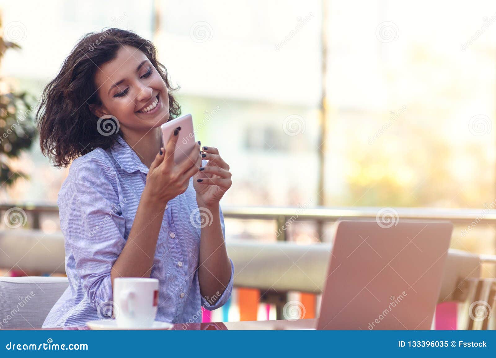 Businesswoman Using Phone while Working in Coffee Shop Stock Image ...