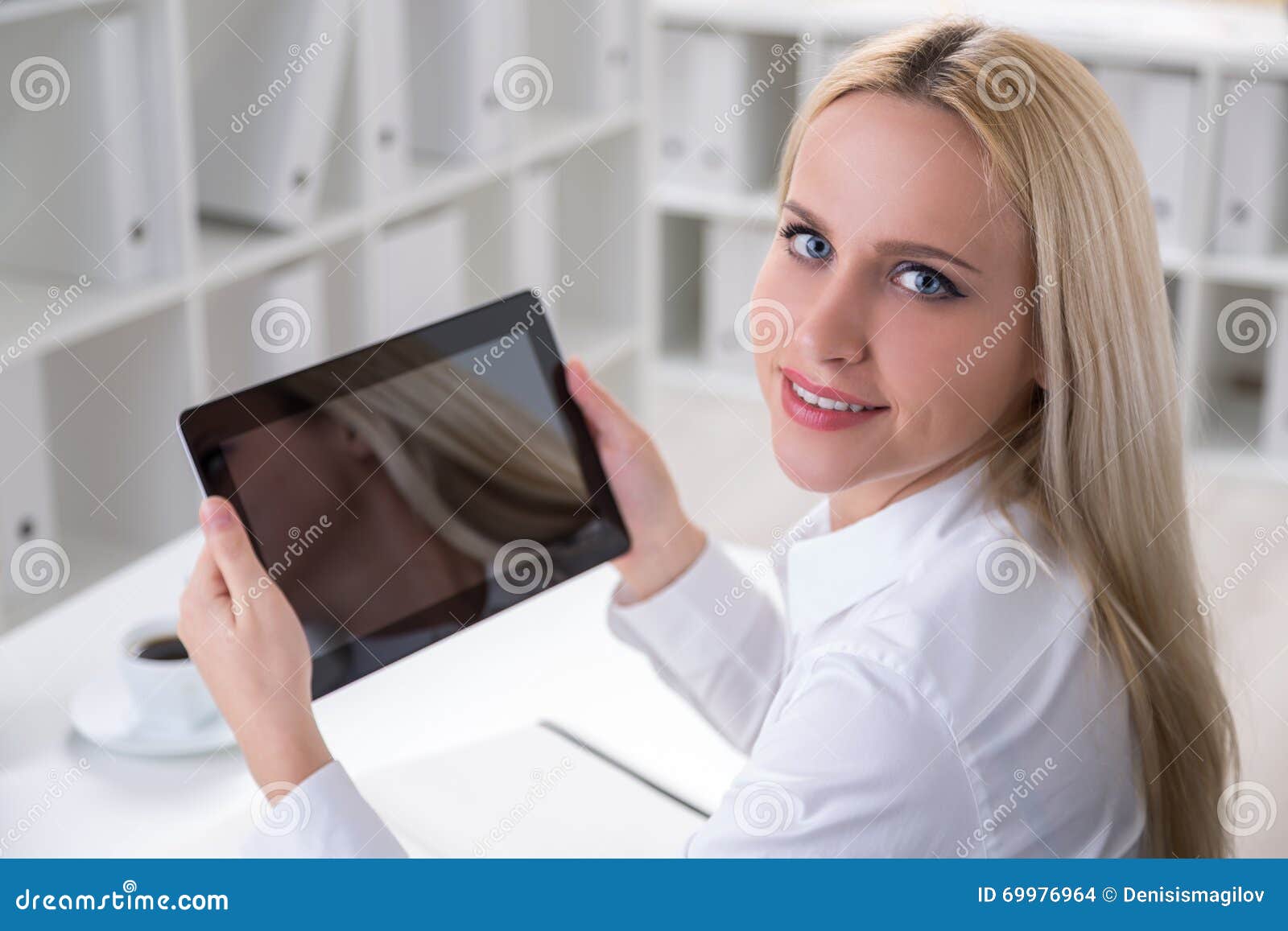 Businesswoman using tablet stock photo. Image of looking - 69976964