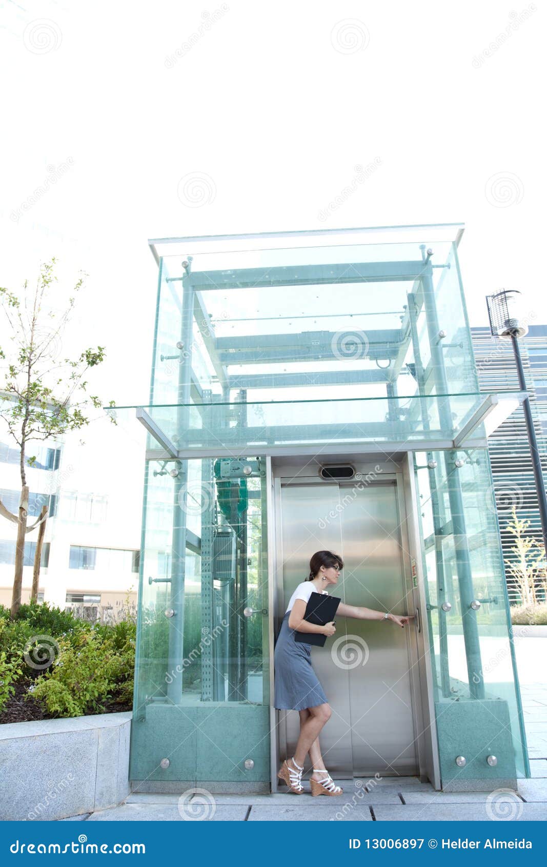 Businesswoman Waiting for the Elevator Stock Image - Image of beautiful ...