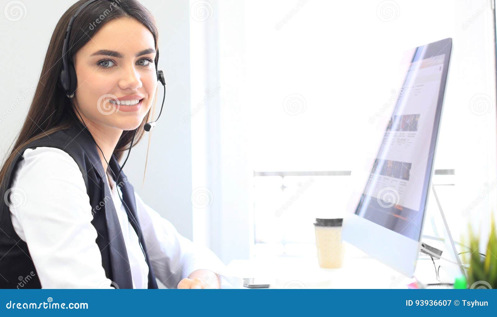 Businesswoman Wearing Microphone Headset Using Computer in the Office ...