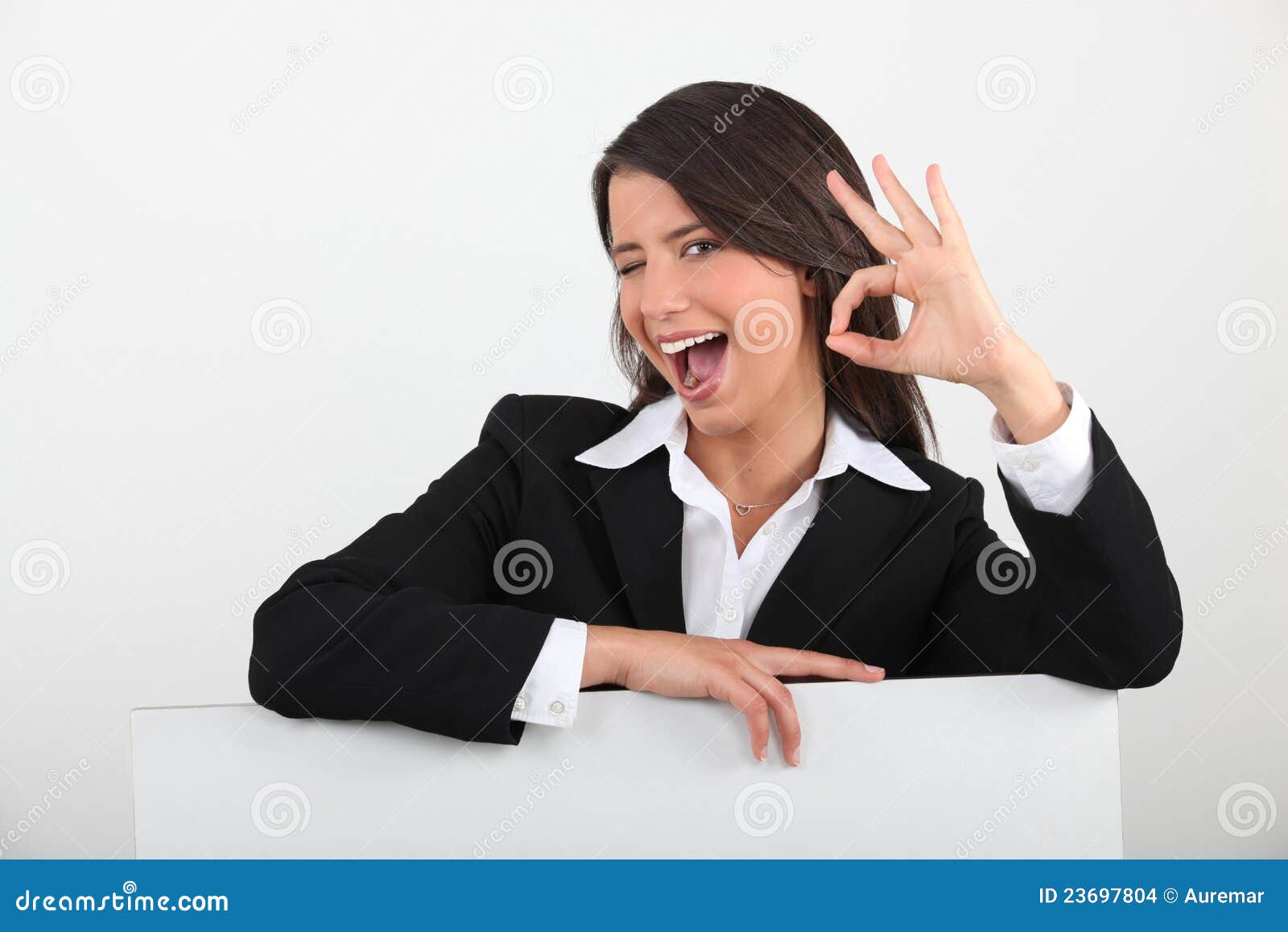 Businesswoman winking stock photo. Image of representative - 23697804