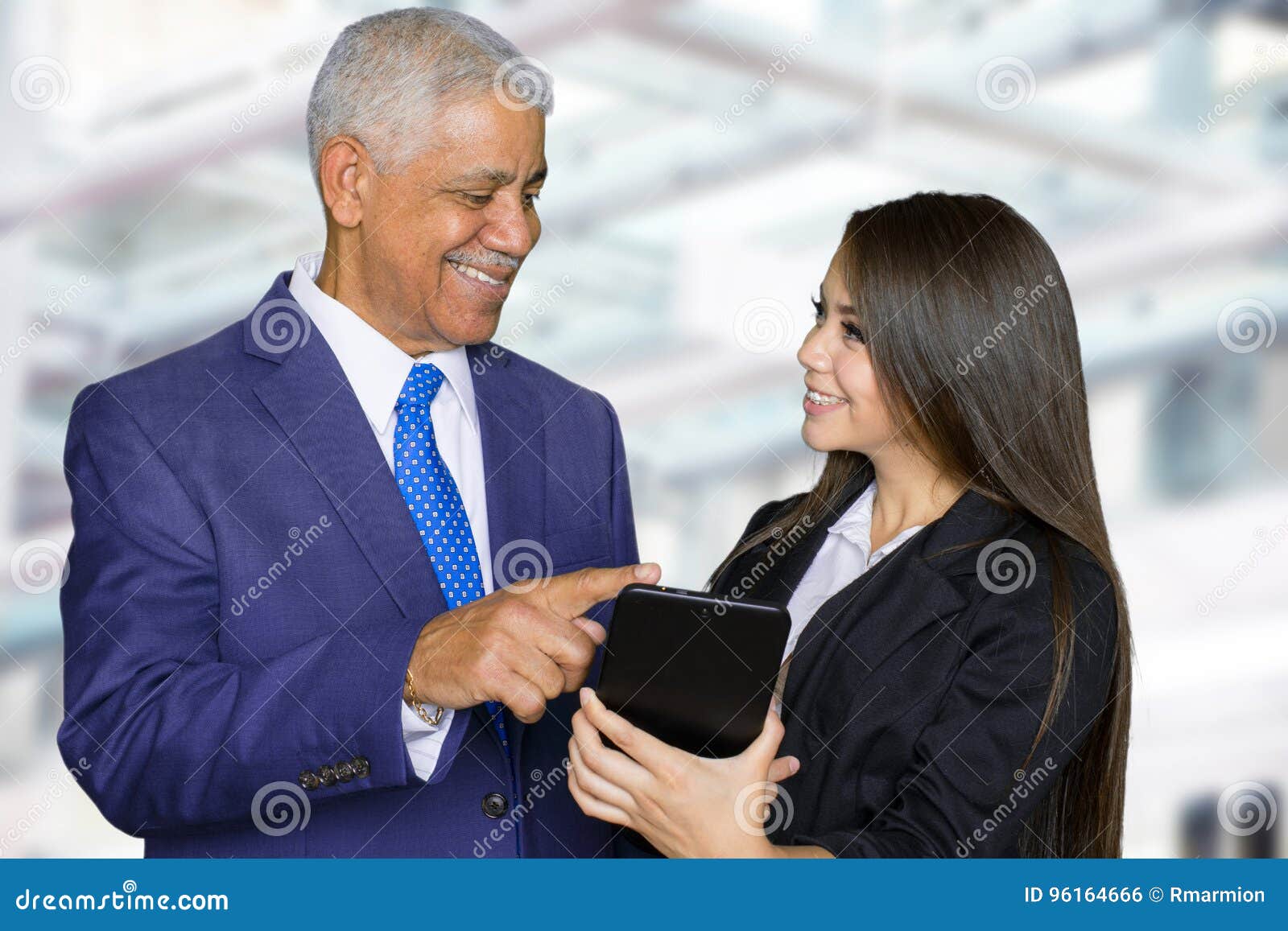 Businesswoman at Work with Senior Client Stock Photo - Image of senior ...