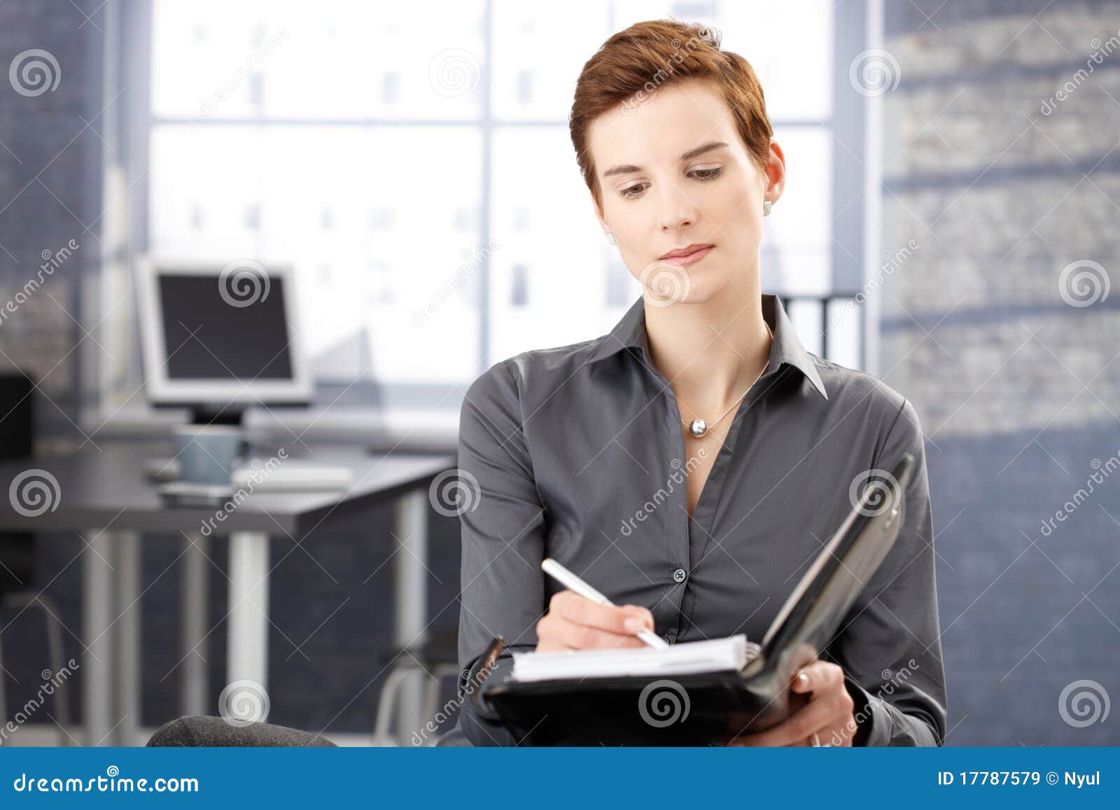 Businesswoman at Work Taking Notes Stock Image - Image of ...