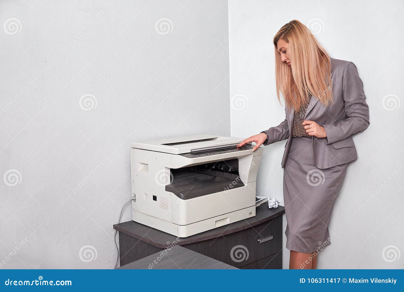 Businesswoman Working on a Copy Machine at the Office Stock Image ...