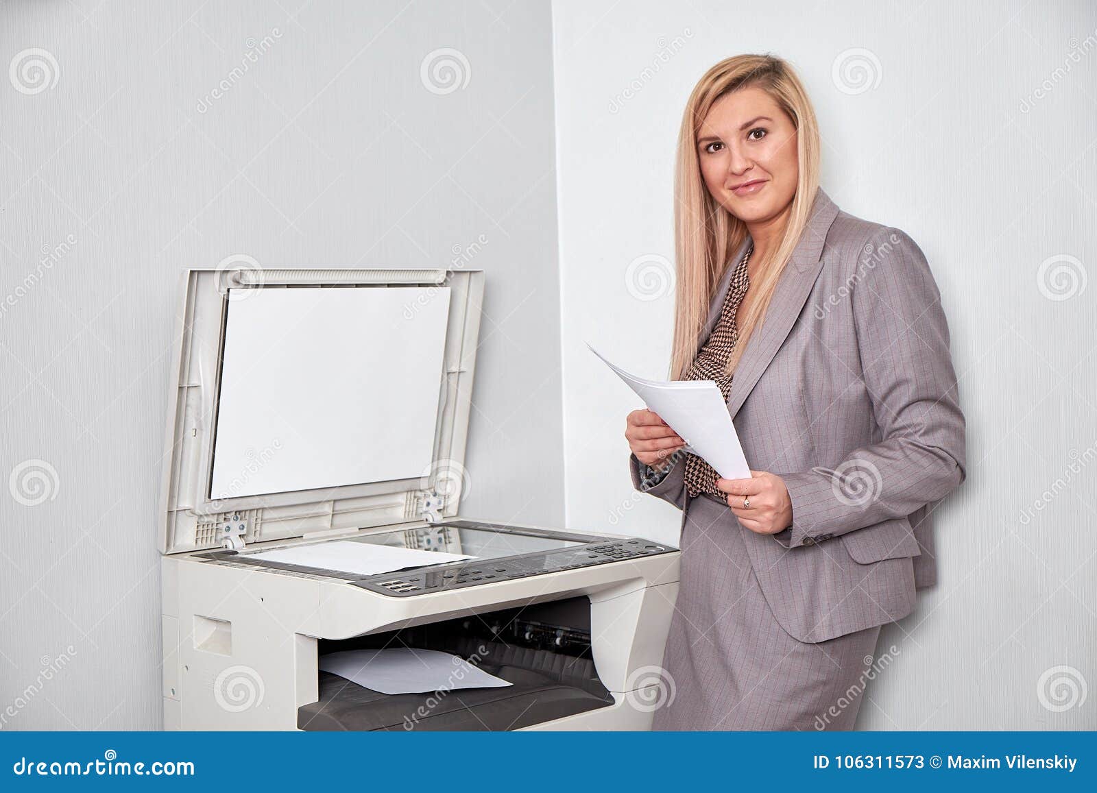 Businesswoman Working on a Copy Machine at the Office Stock Image ...
