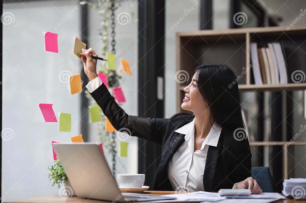Businesswoman Write Tasks Creative Ideas and Planning on Sticky Post it ...