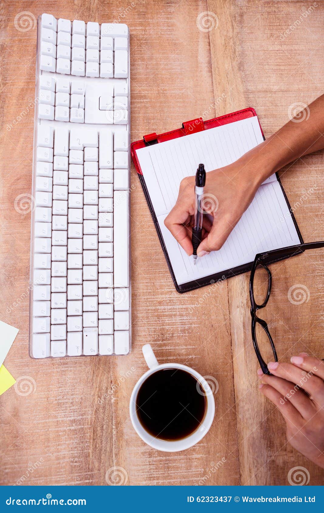 Businesswoman Writing on Diary on Desk Stock Image - Image of planner ...