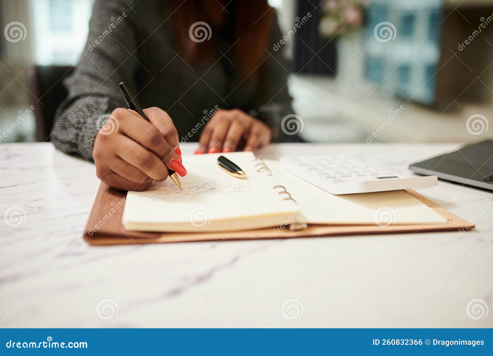 Businesswoman Writing in Planner Stock Photo - Image of pretty, manager ...