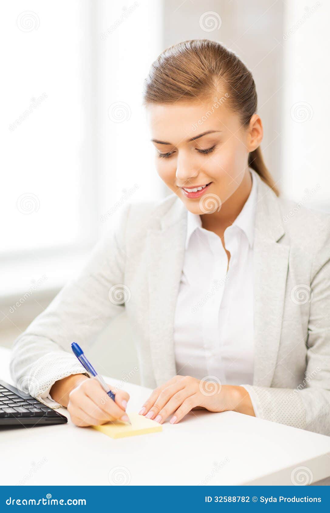 Businesswoman Writing on Sticky Note Stock Photo - Image of girl, paper ...