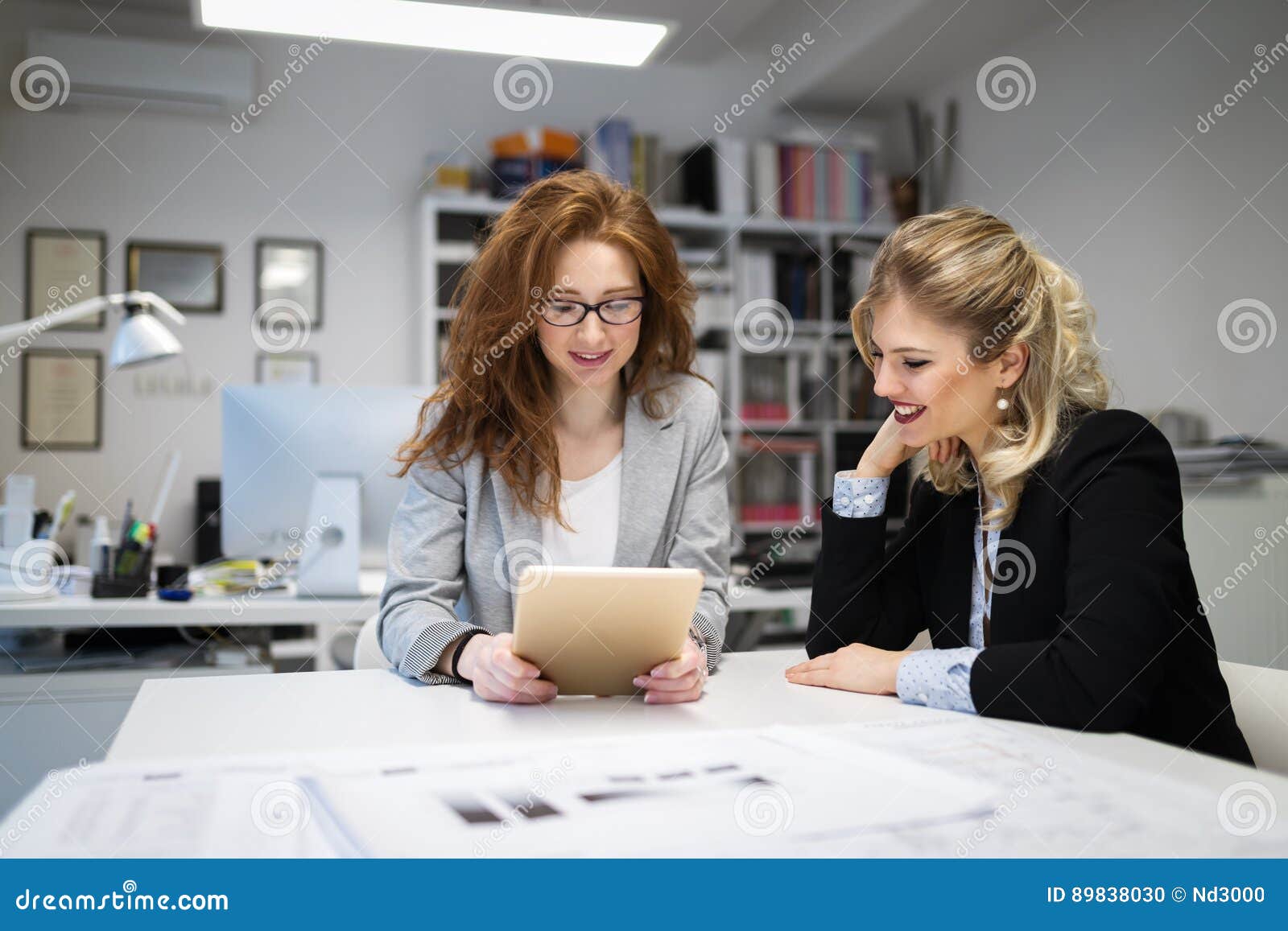 Businesswomen and Architects Talking in Office Stock Photo - Image of ...