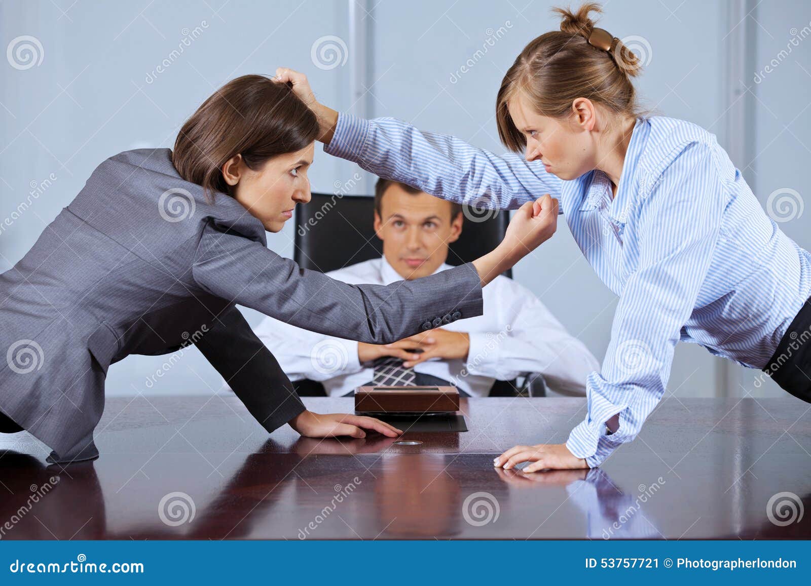 Businesswomen Arguing in Front of Businessman at Office Stock Image ...