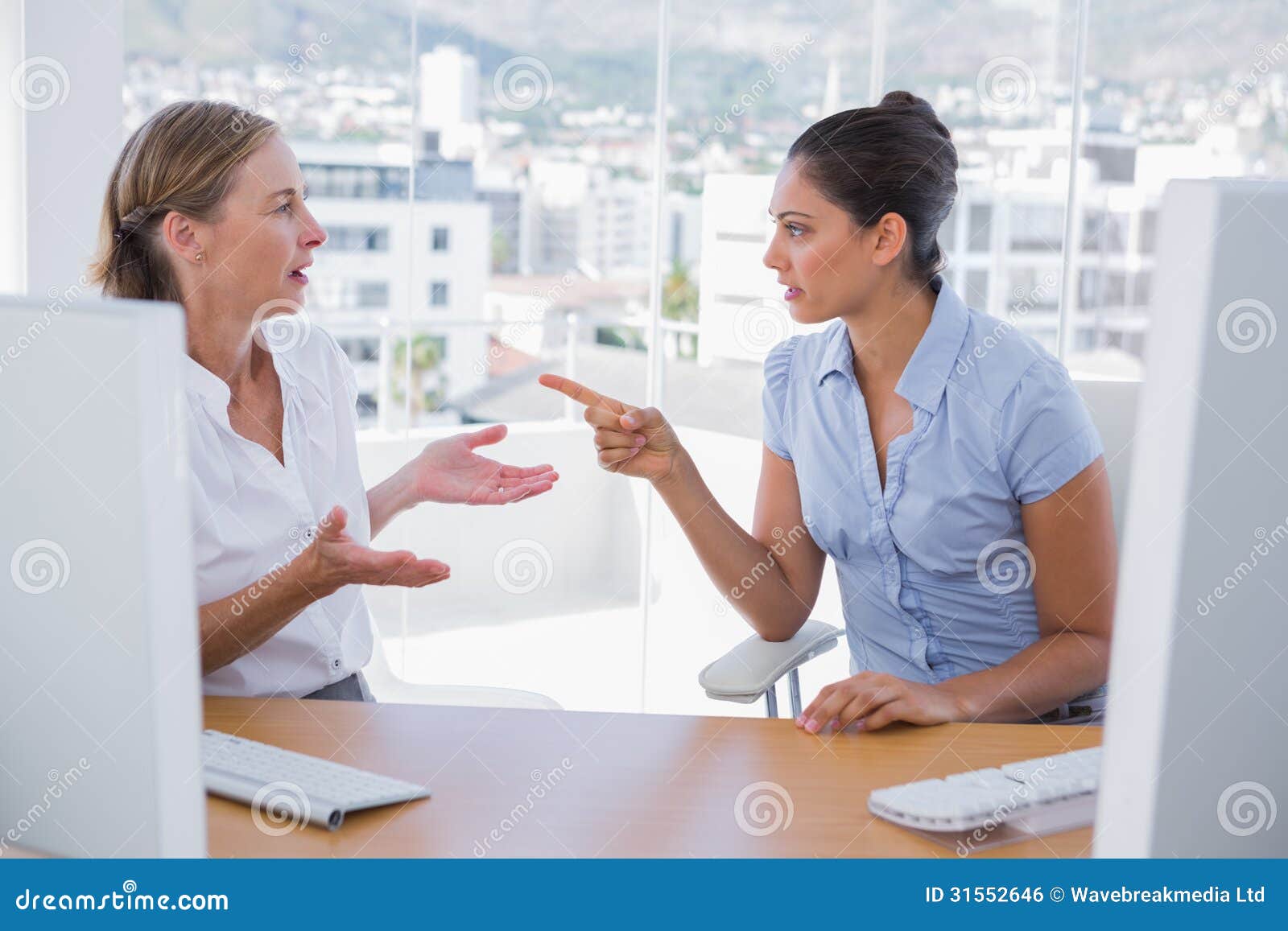 Businesswomen Arguing at Their Desk Stock Photo - Image of frustrated ...