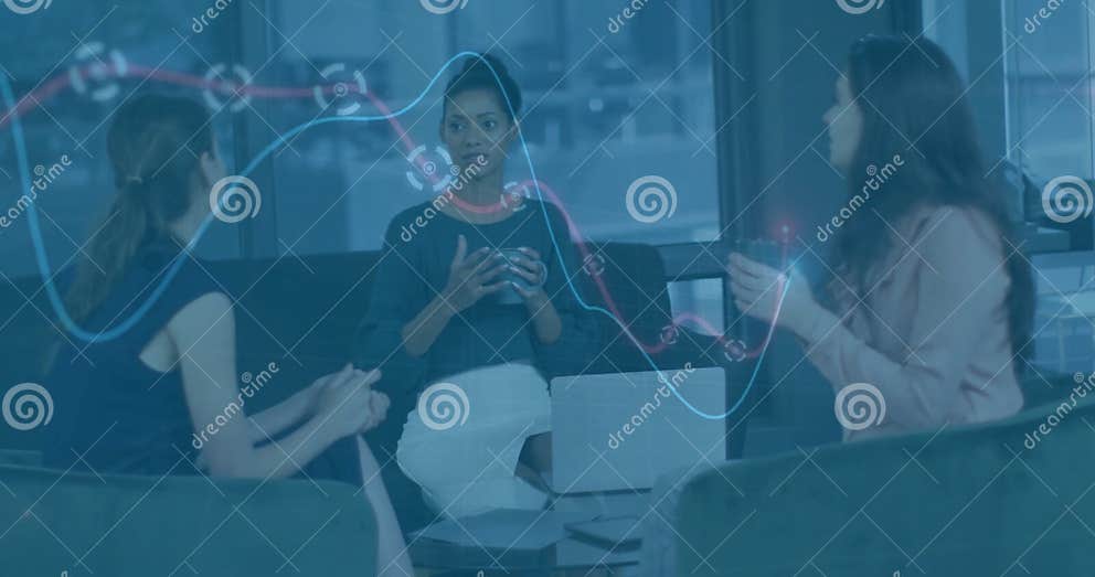 Businesswomen Discussing Strategy with Data Visualization Image Over ...