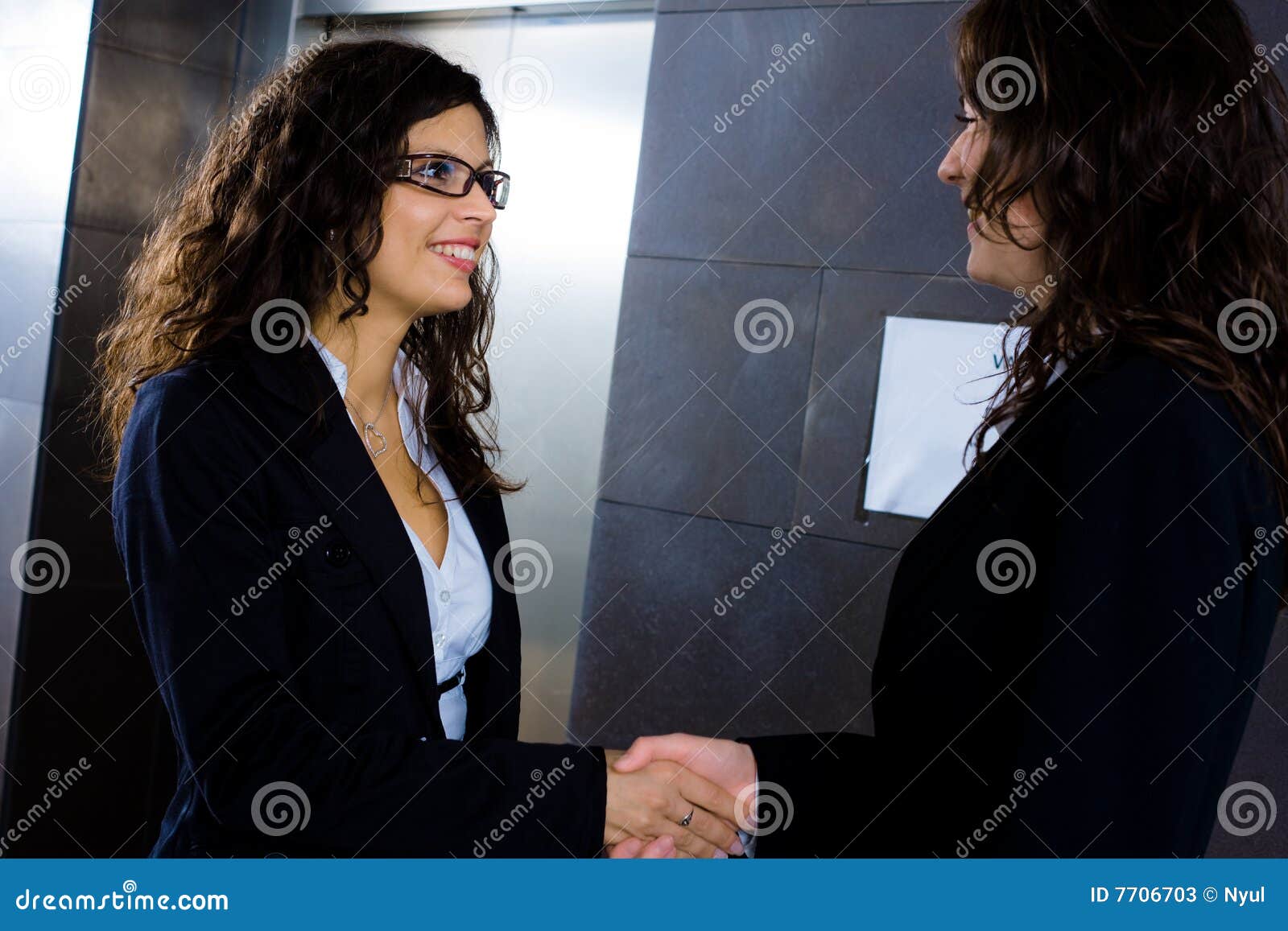 Businesswomen Shaking Hands As Hello In Office, Women Is Enjoying With ...