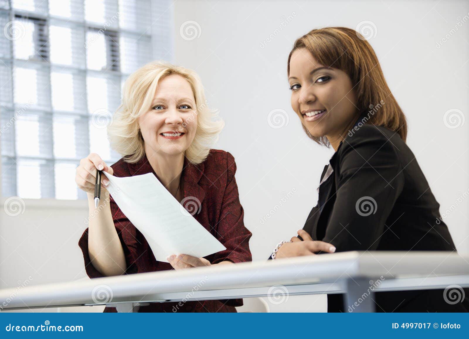 Businesswomen smiling stock image. Image of colleague - 4997017
