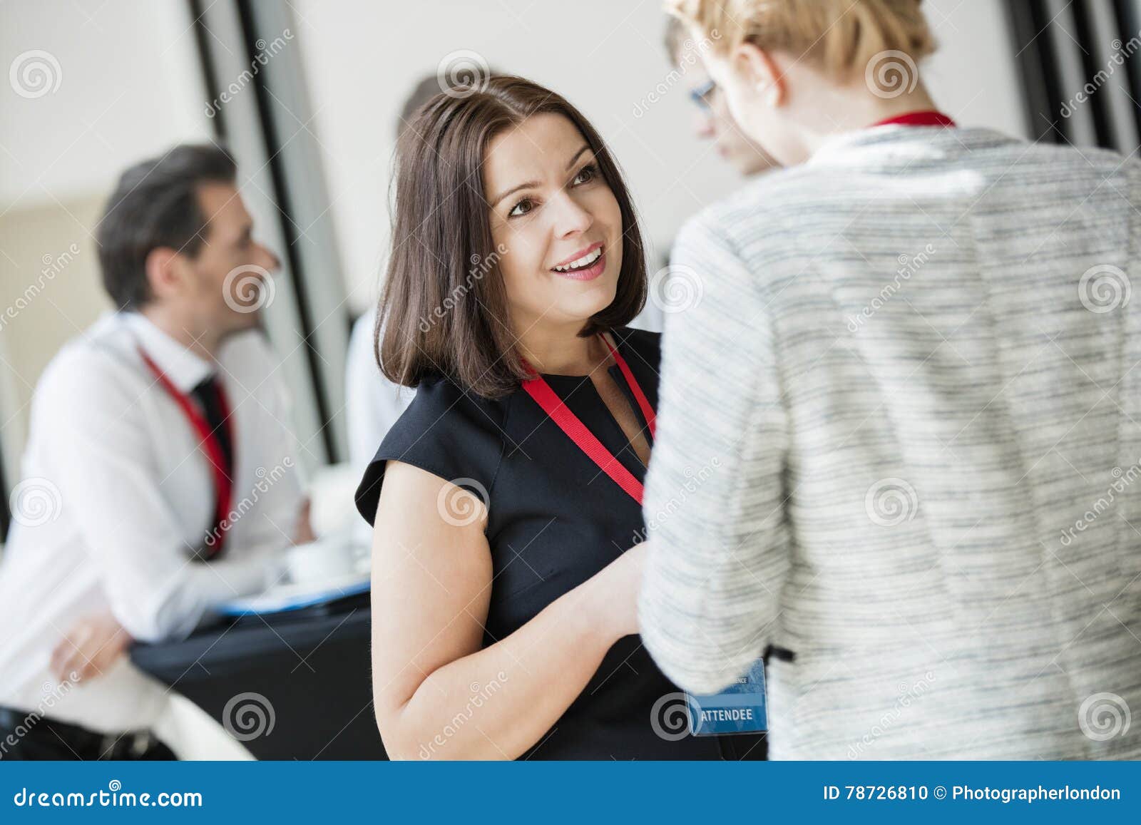 Businesswomen Talking during Coffee Break at Convention Center Stock ...