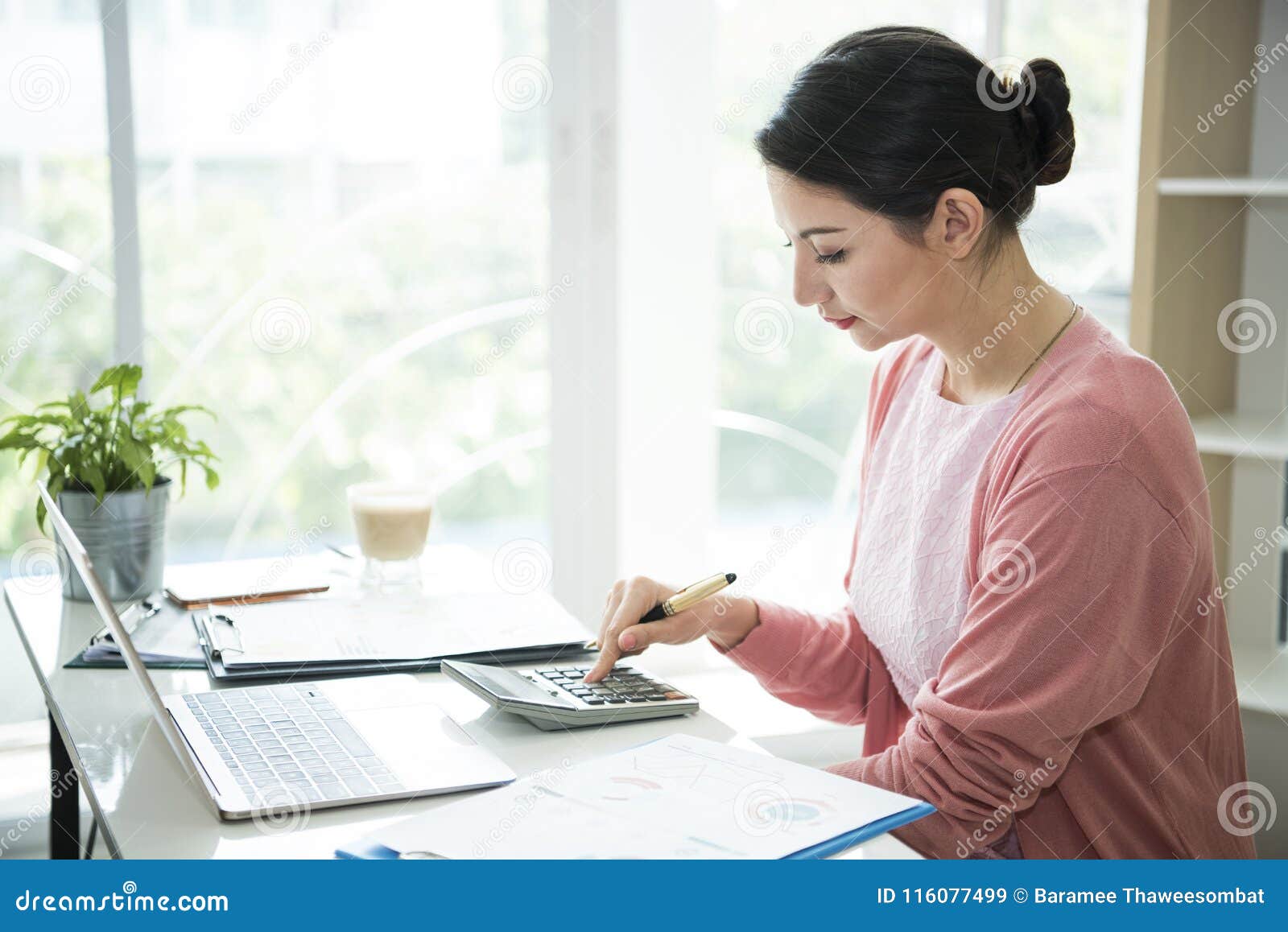 Businesswomen Using Calculator with Analyzing Financial Figures Stock ...