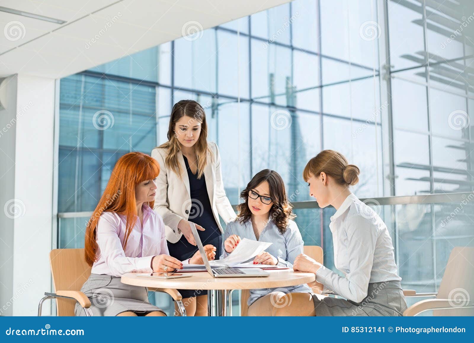 Businesswomen Working at Table in Office Stock Image - Image of ...